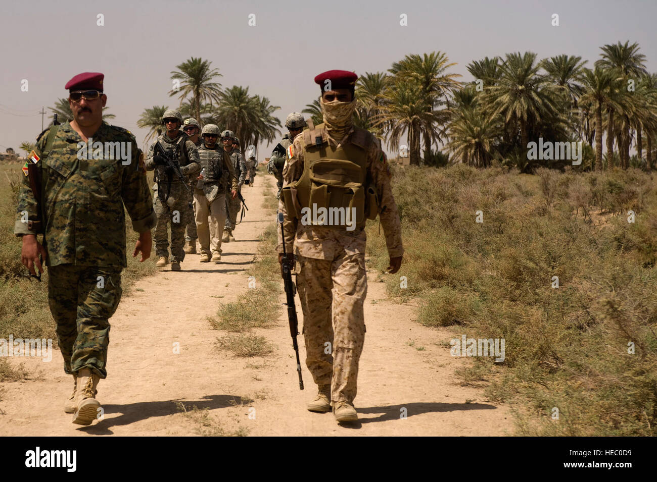 Iraqi soldiers from the 4th Battalion, 18th Iraqi Army Brigade, patrol ...