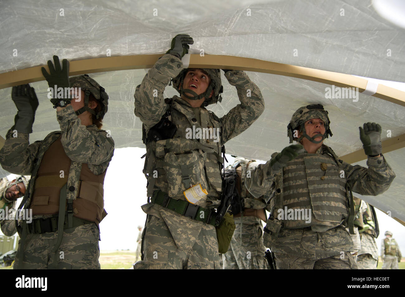 U.S. Airmen assemble a tent during Joint Readiness Training Center ...