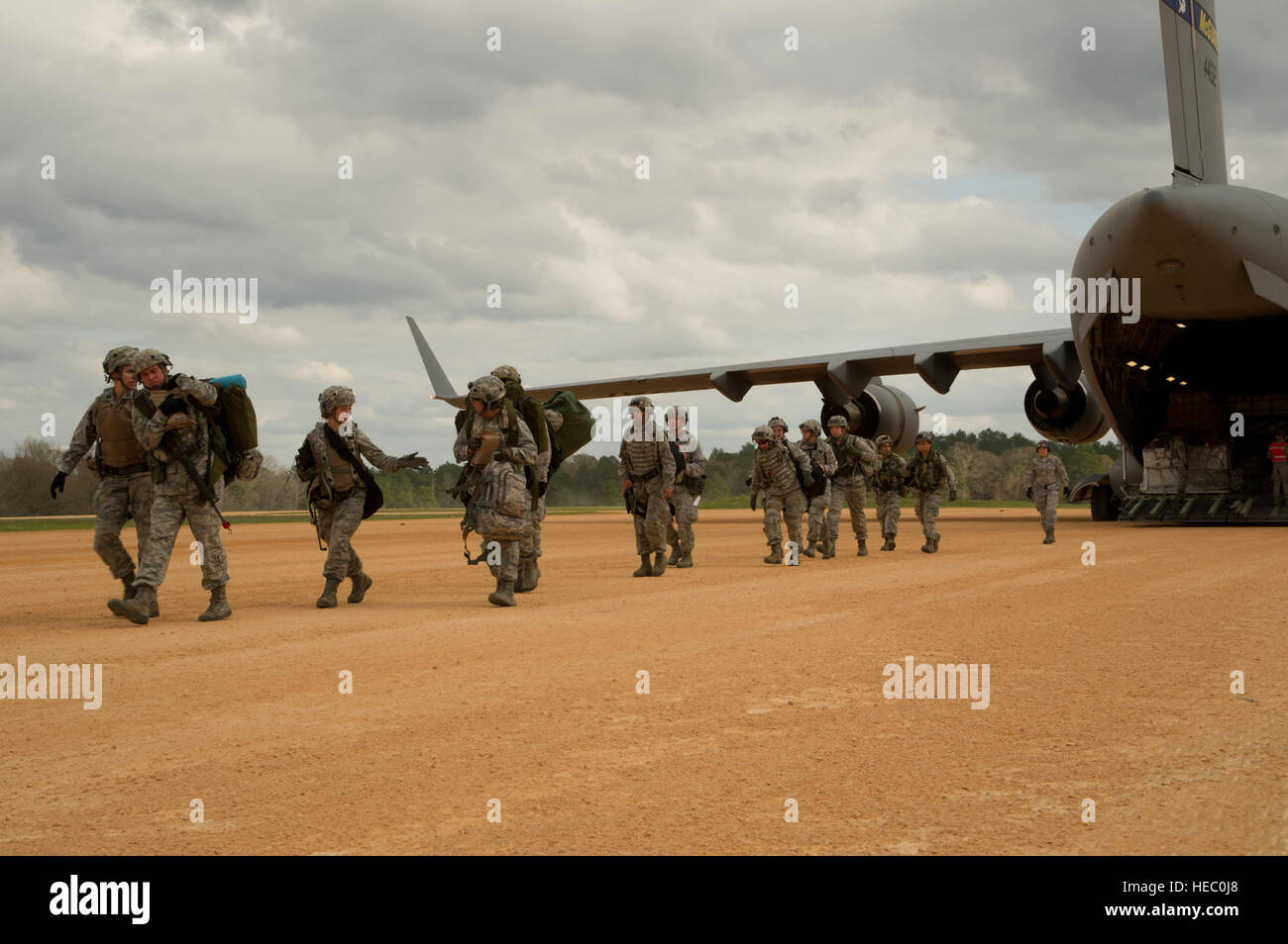 U.S. Airmen unload medical equipment from a C-17 Globemaster III ...