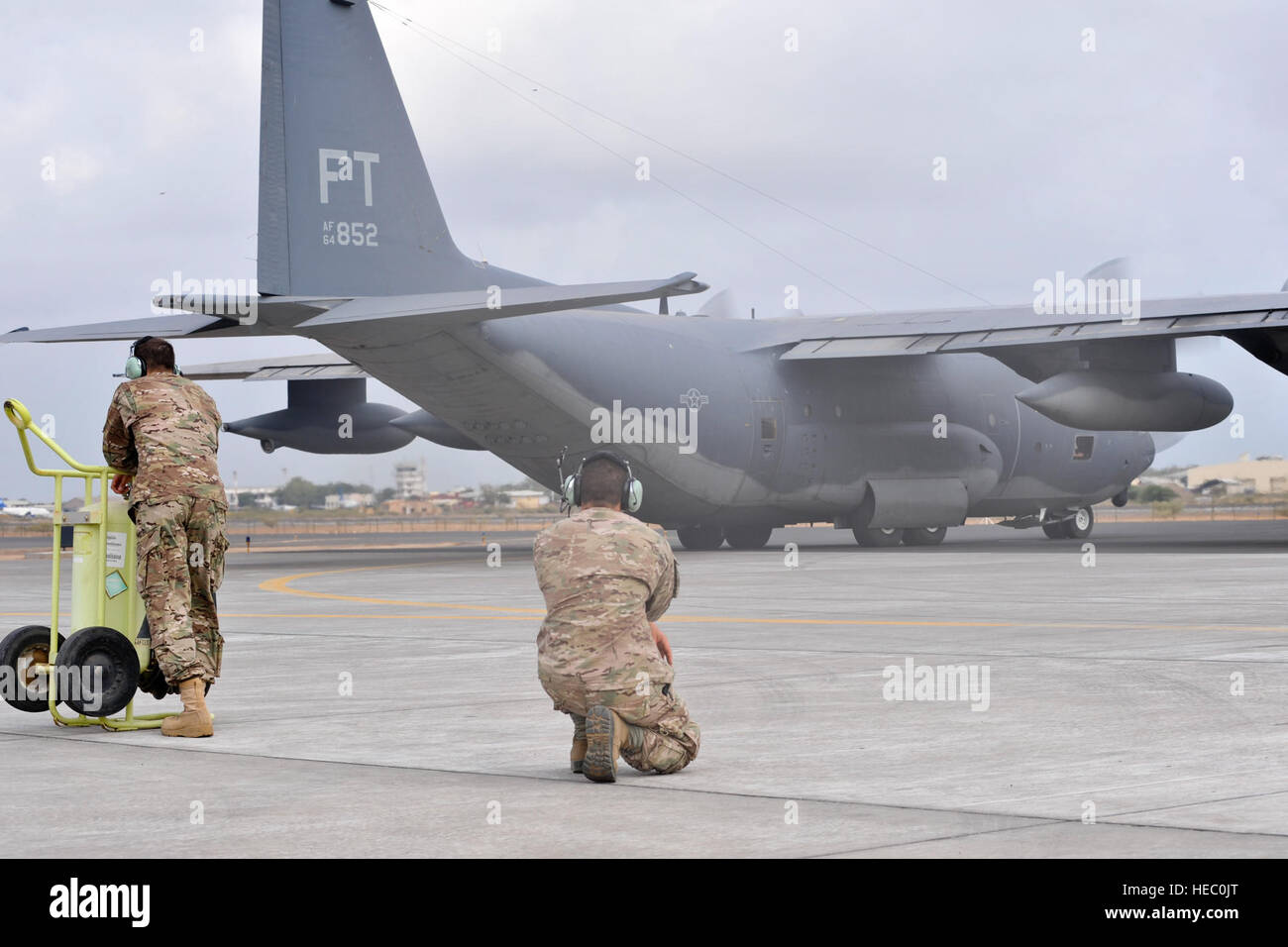 U.S. Airmen with the 303rd Expeditionary Rescue Squadron (ERQS) watch ...