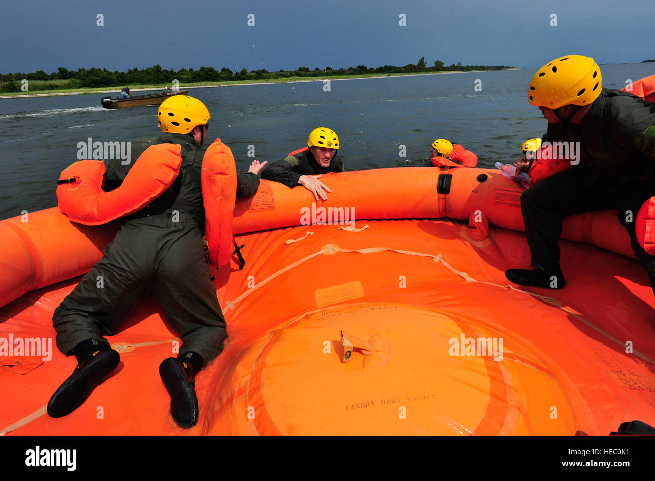 U.S. Airmen with the 305th Air Mobility Wing sit in a raft while ...