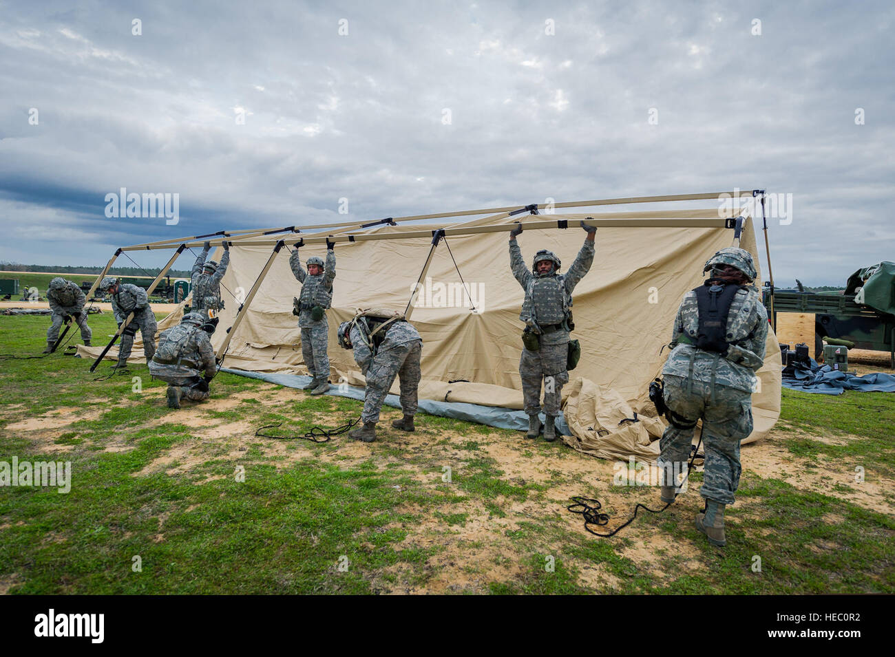 U.S. Air Force aeromedical evacuation team members erect a tent at the ...
