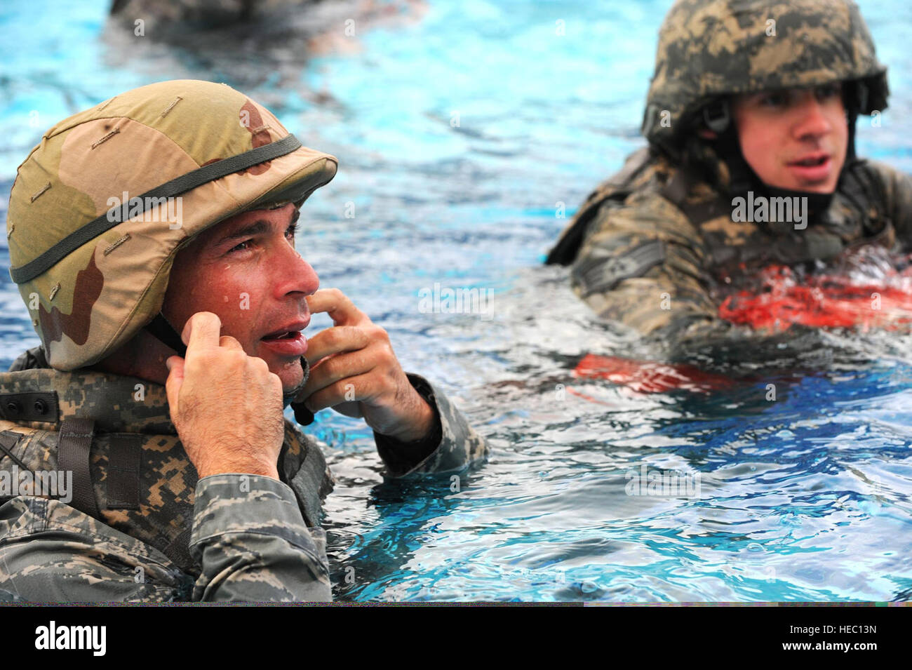 U.S. Air Force Lt. Col. Ronald Pieri, foreground, dons his helmet to ...