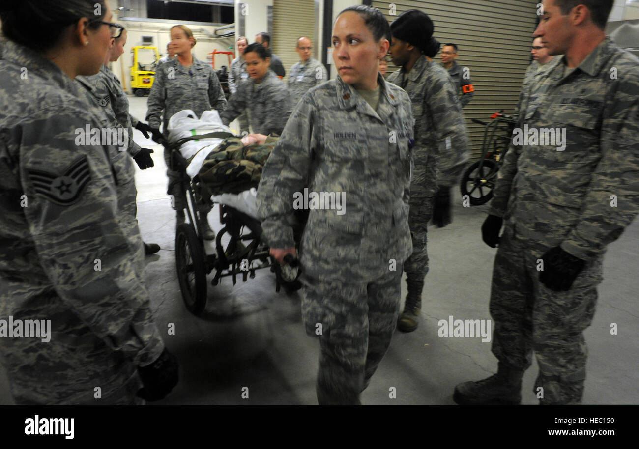 U.S. Air Force Maj. Sunny Holden, center, with the 673rd Medical Group ...