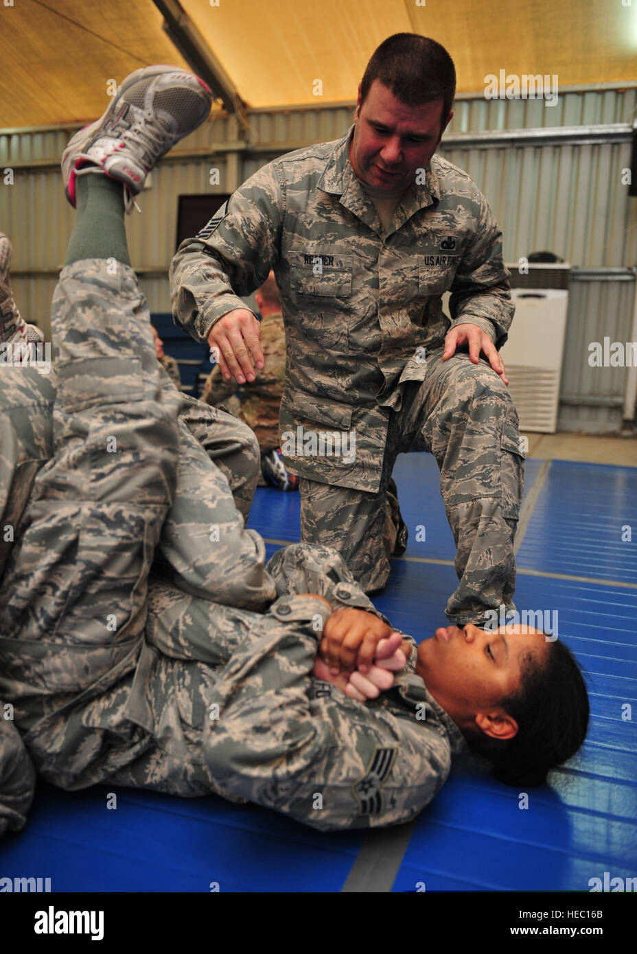 U.S. Air Force Master Sgt. Robert Reader, kneeling, with the 380th Air ...