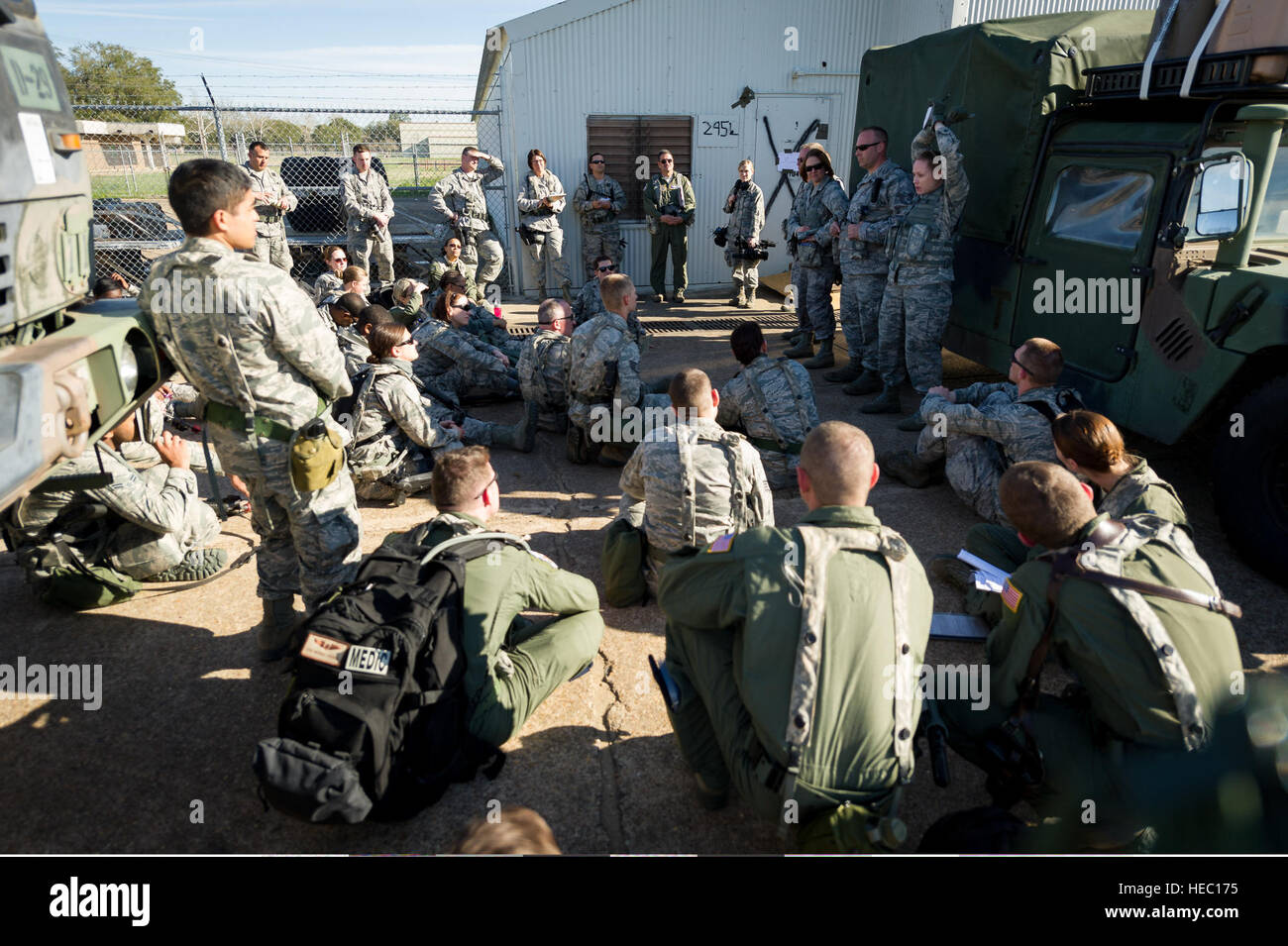 U.S. Air Force observer-controller-trainers provide feedback to ...