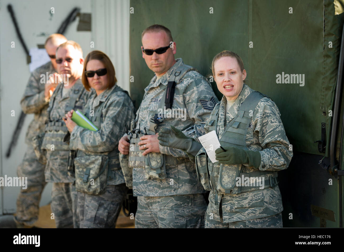 U.S. Air Force observer-controller-trainers provide feedback to ...