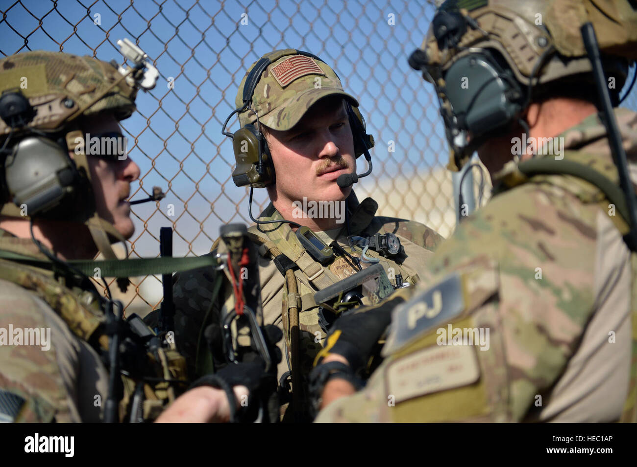 U.S. Air Force Senior Airman Jake Racicot, center, a pararescue team ...