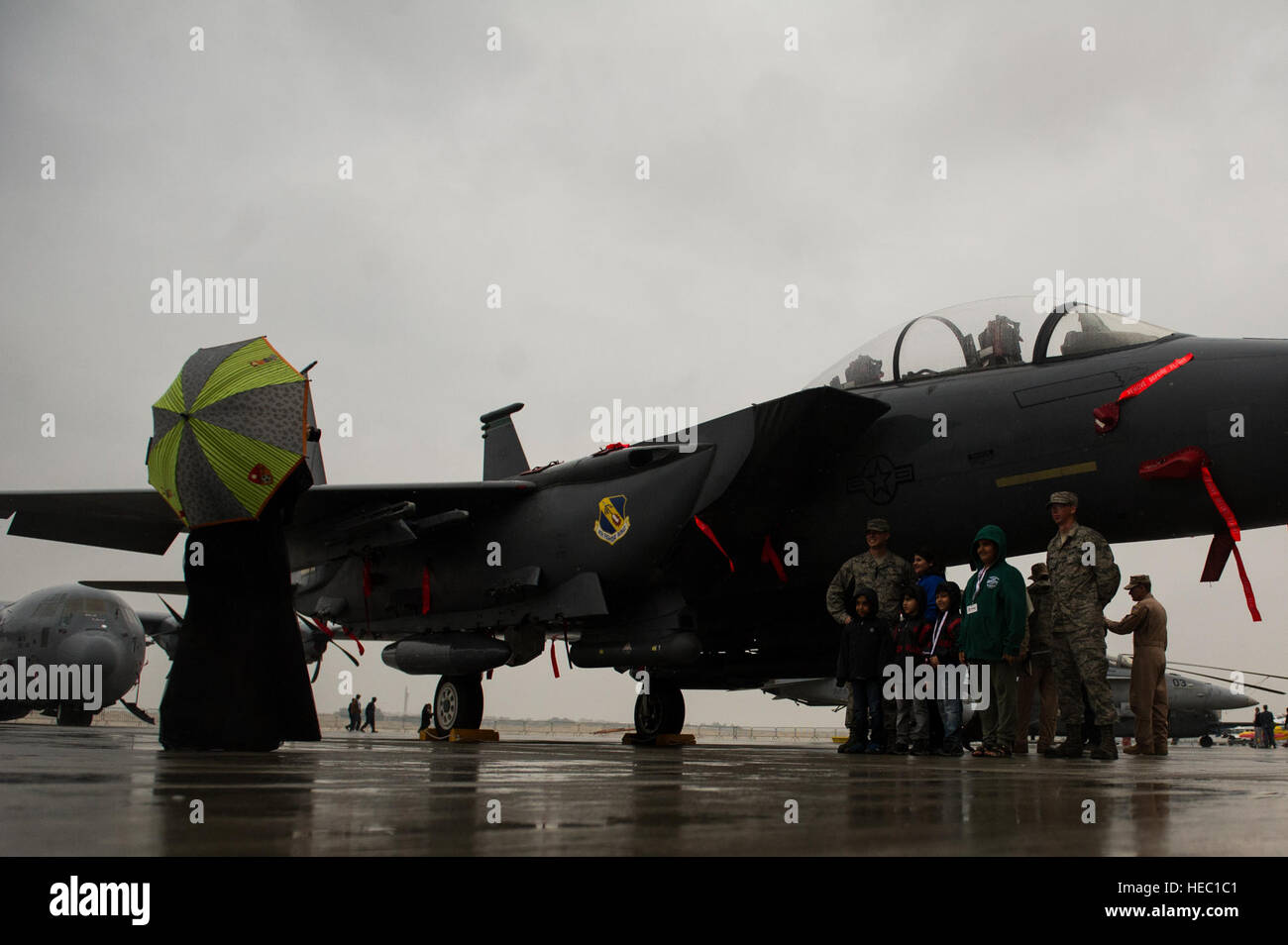 U.S. Air Force Senior Airman Nick Dryden, center, an electrical and ...