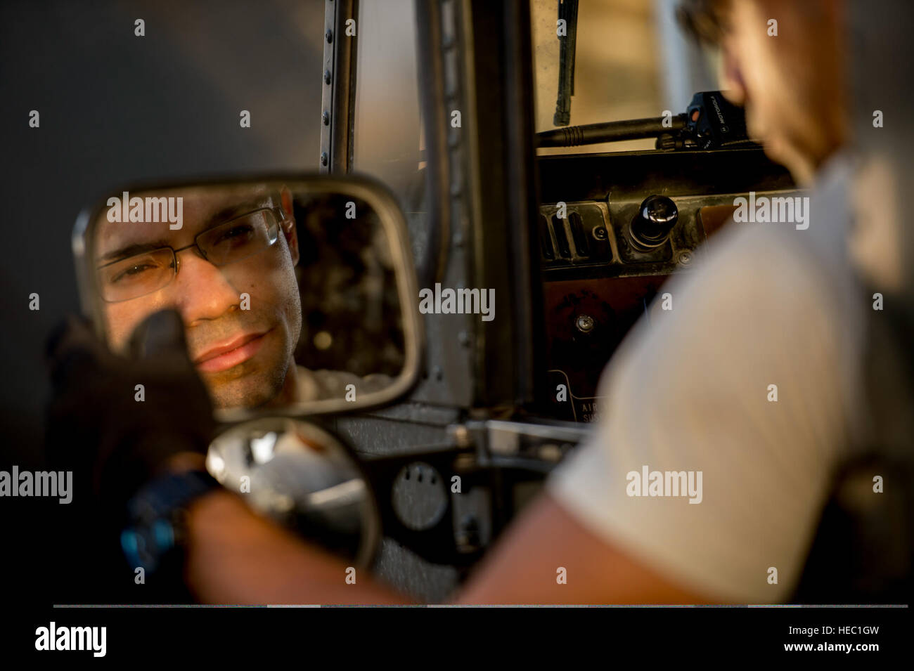 Staff Sgt. Raymon Martinez checks his mirror while pulling cargo to be ...