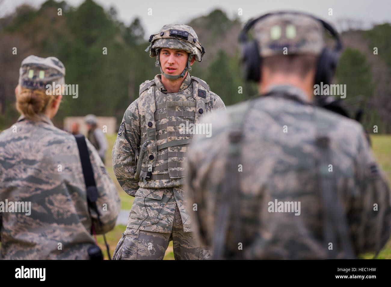 U.S. Air Force Staff Sgt. Weston Fischer, center, a radio frequency ...