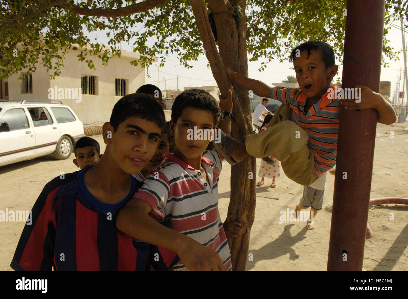 Iraqi children play near by as soldiers from the 8th division Iraqi ...