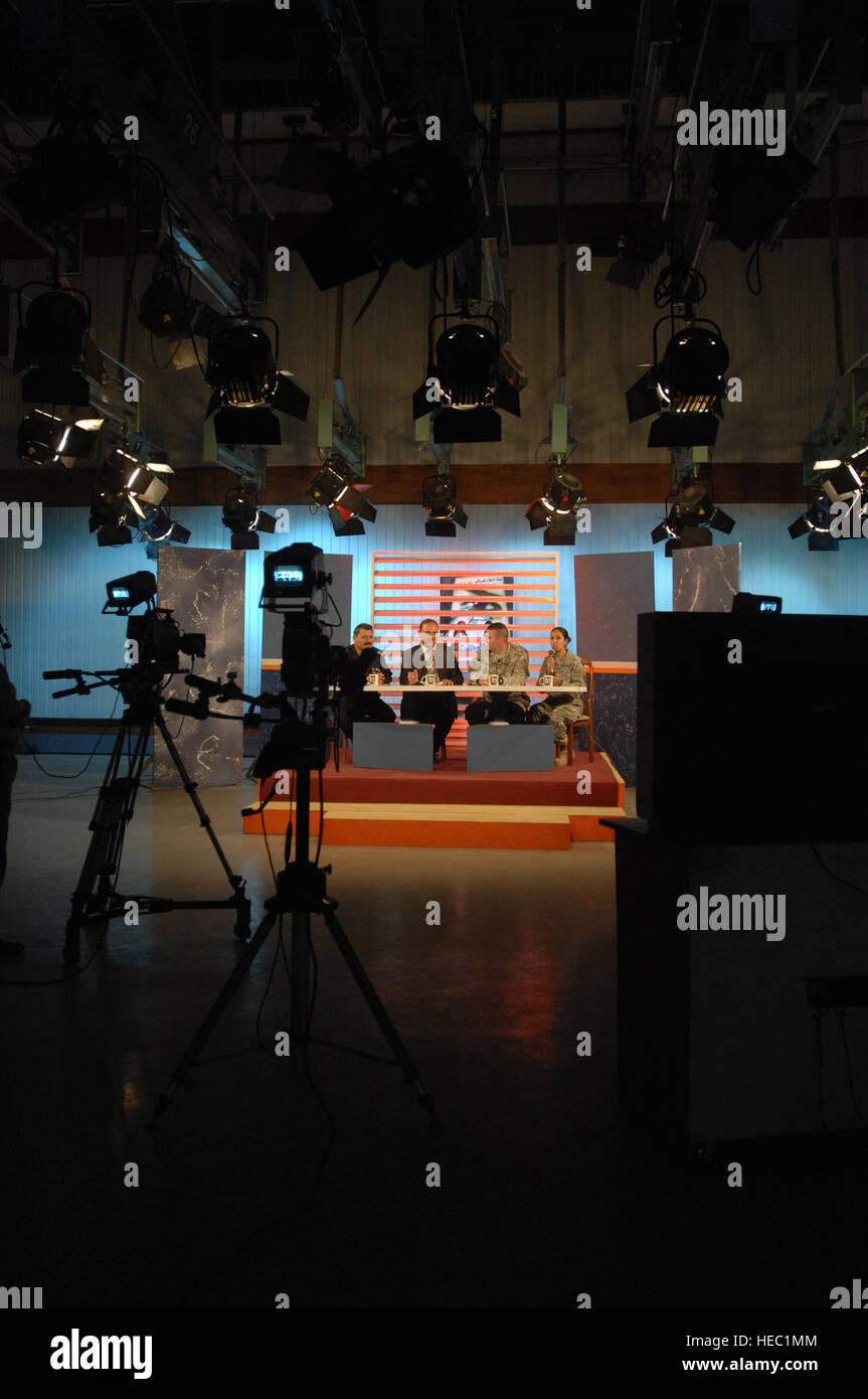Iraqi police and U.S. Army personnel review a broadcast sequence at ...