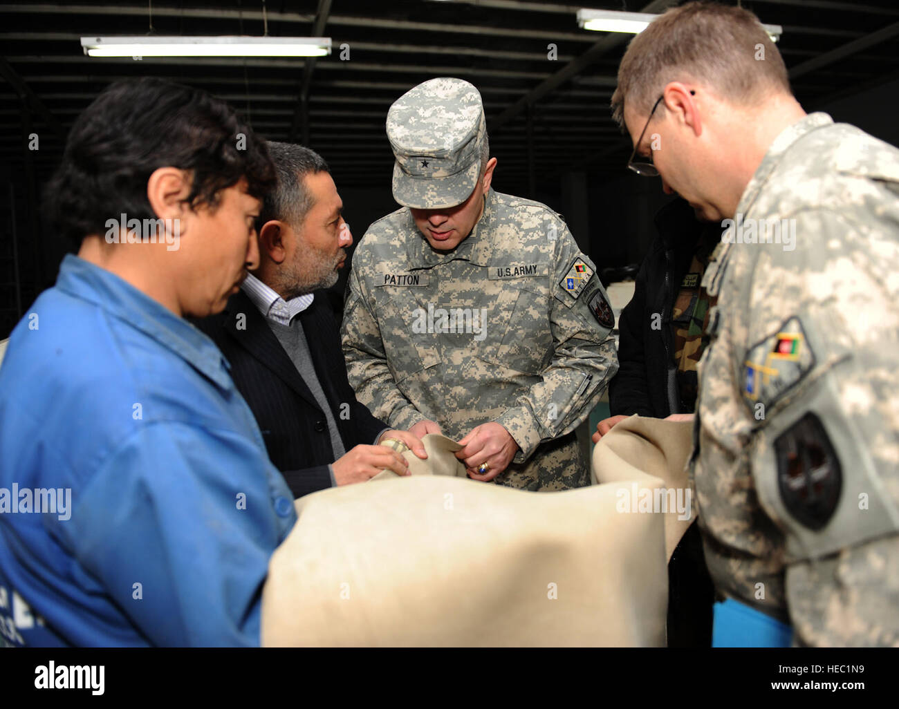 U.S. Army Brig. Gen. Gary Patton, center, Combined Security Transition ...