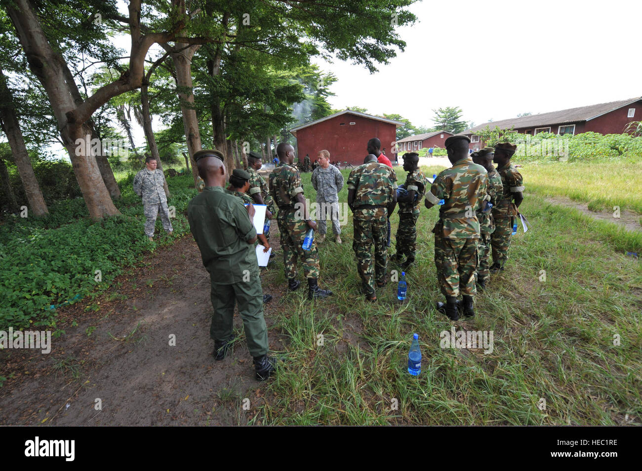 U.S. Army Sgt 1st Class Lucas Velmer, center, talks with Burundi ...