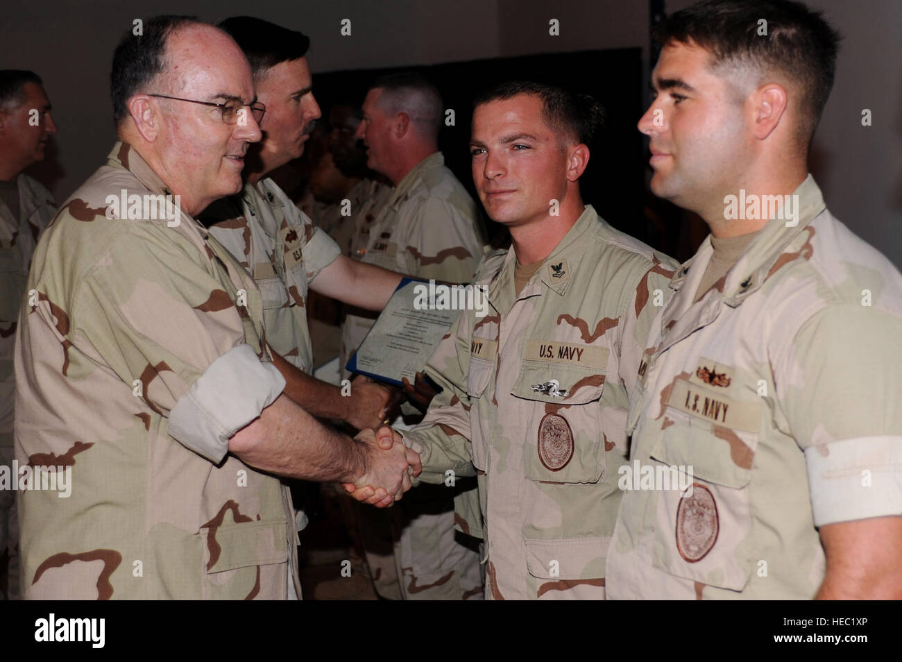 Adm. J. C. Harvey Jr., commander, U.S. Fleet Forces Command, pins the ...