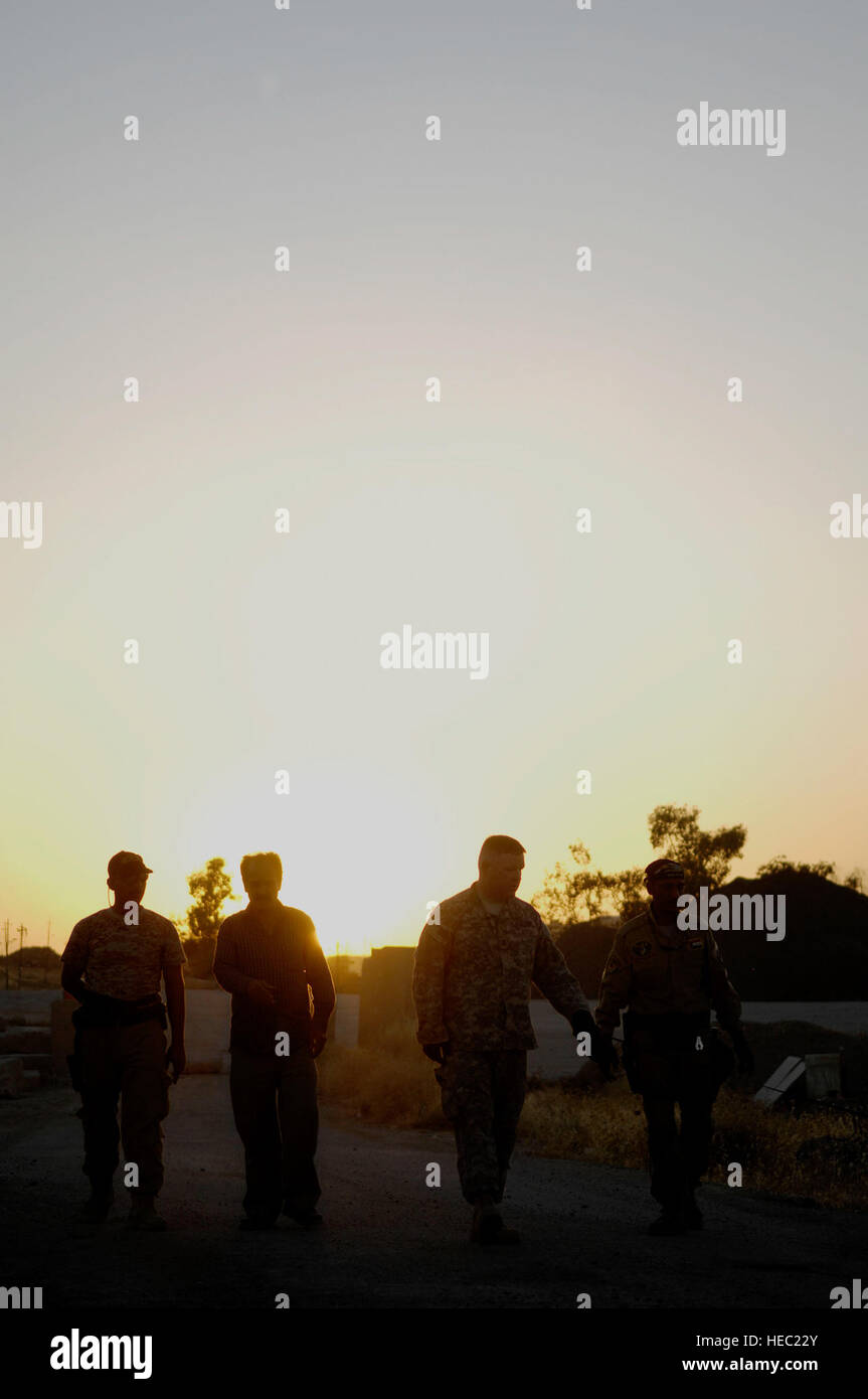 Iraqi dog handlers walk and talk with U.S. Soldiers from the 25th ...