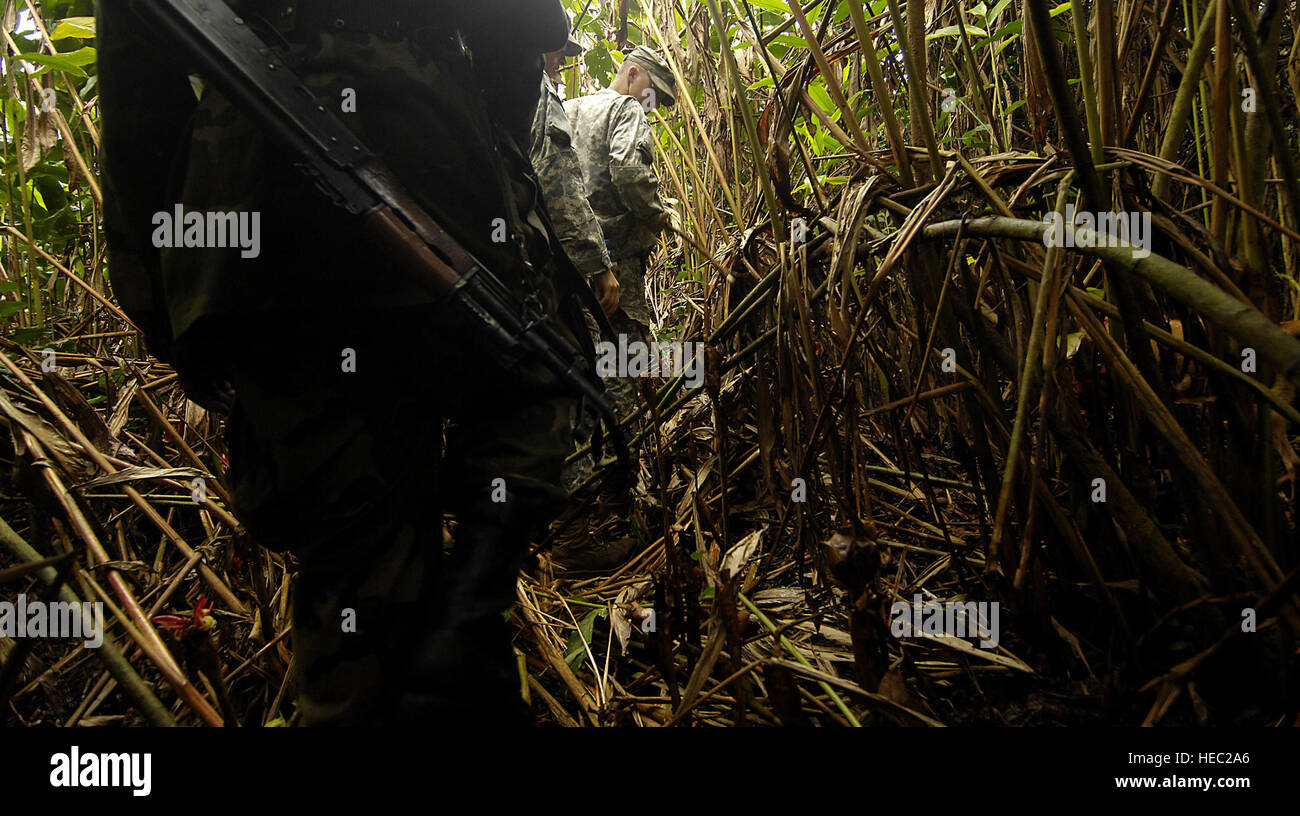 Uganda Army soldiers use compasses and maps to locate field markers ...