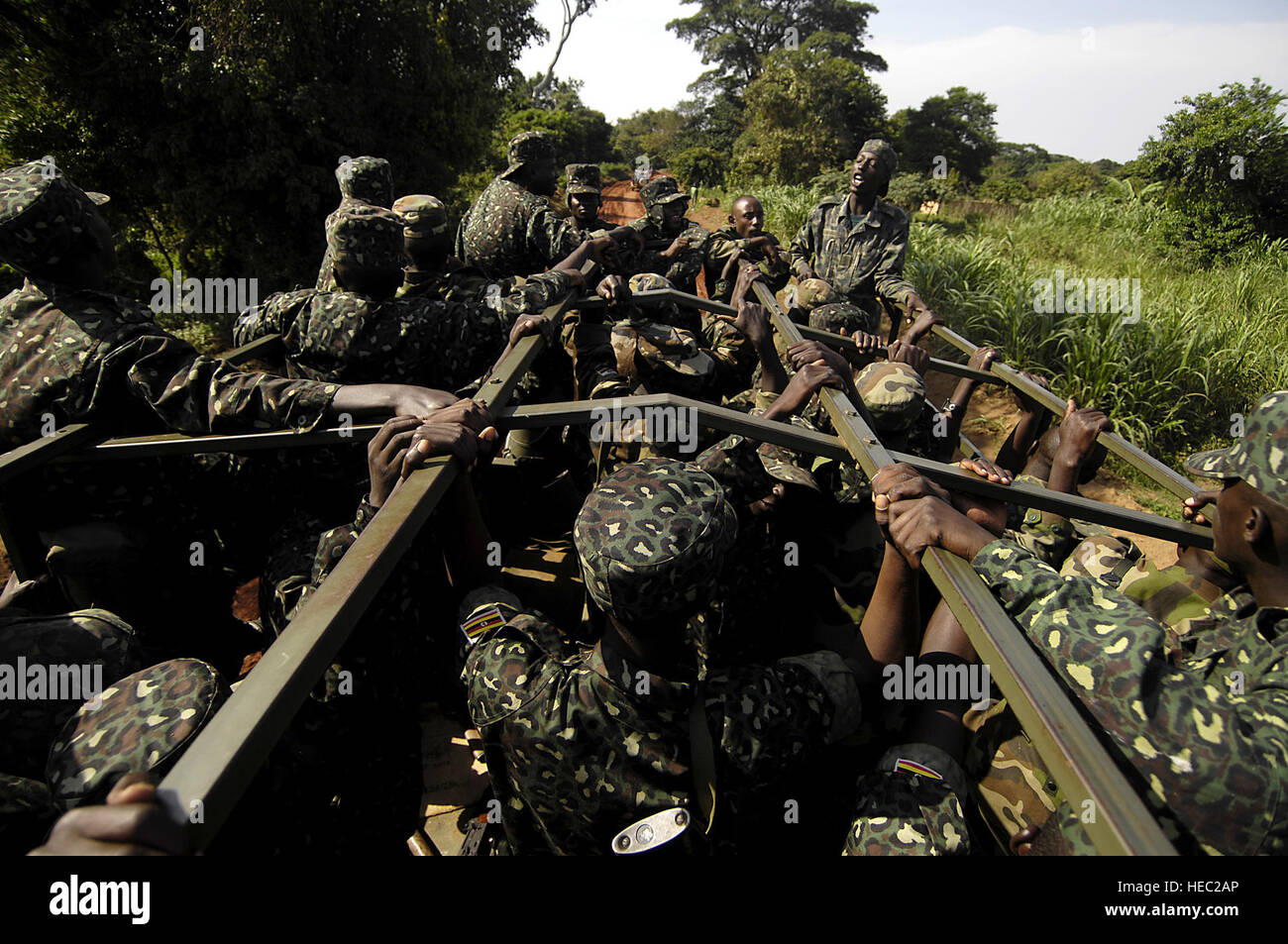 Uganda Army soldiers ride back to camp in the back of a two ton truck ...