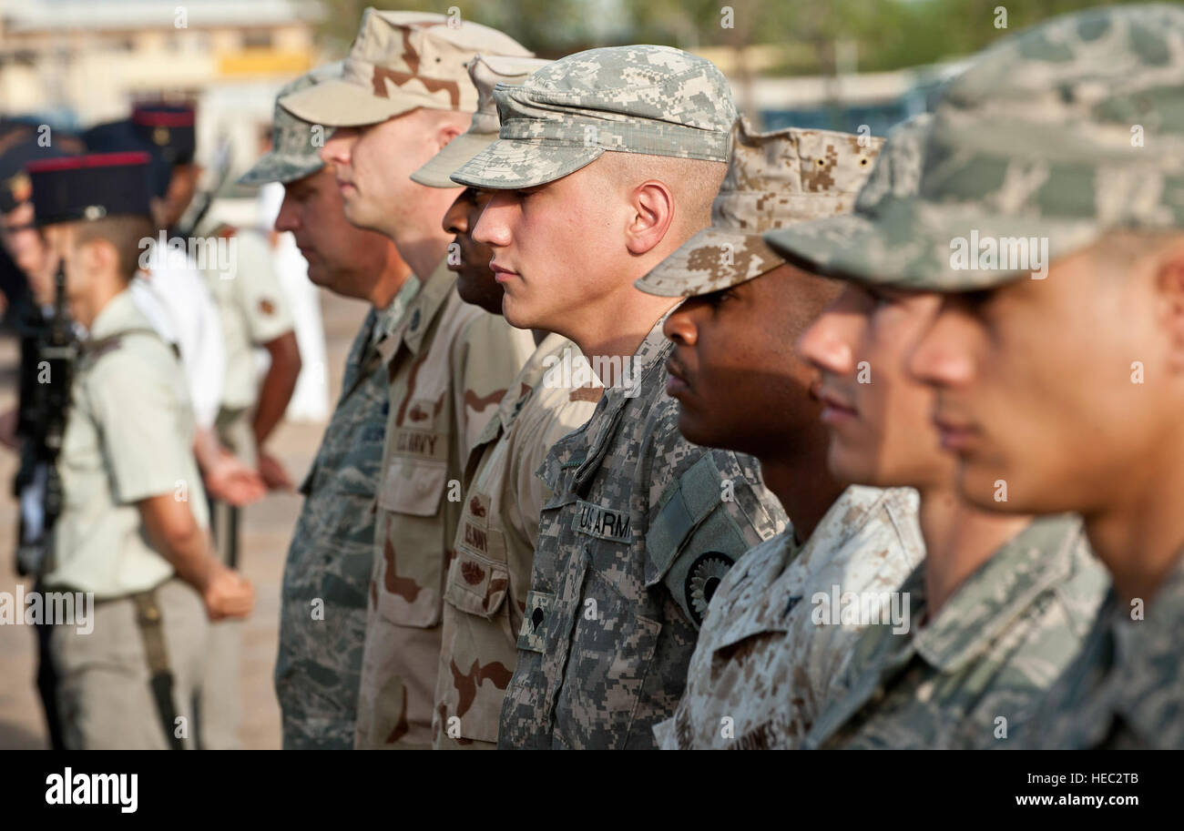 A formation of U.S. service members representing the Marine Corps, Navy ...