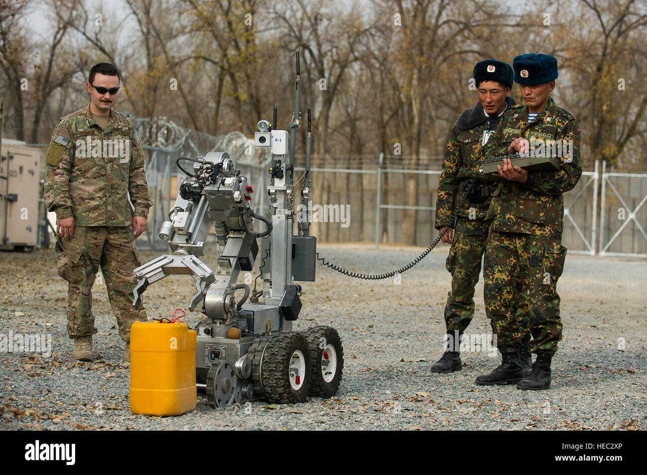 Members of the Kyrgyz military use an explosive ordnance disposal ...