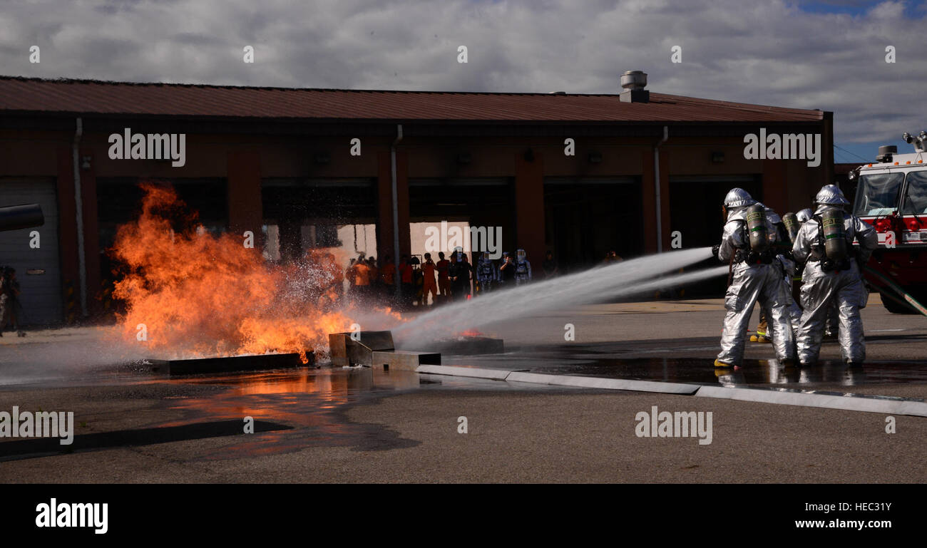 Firefighters from the Songtan fire station practice sweeping away and ...