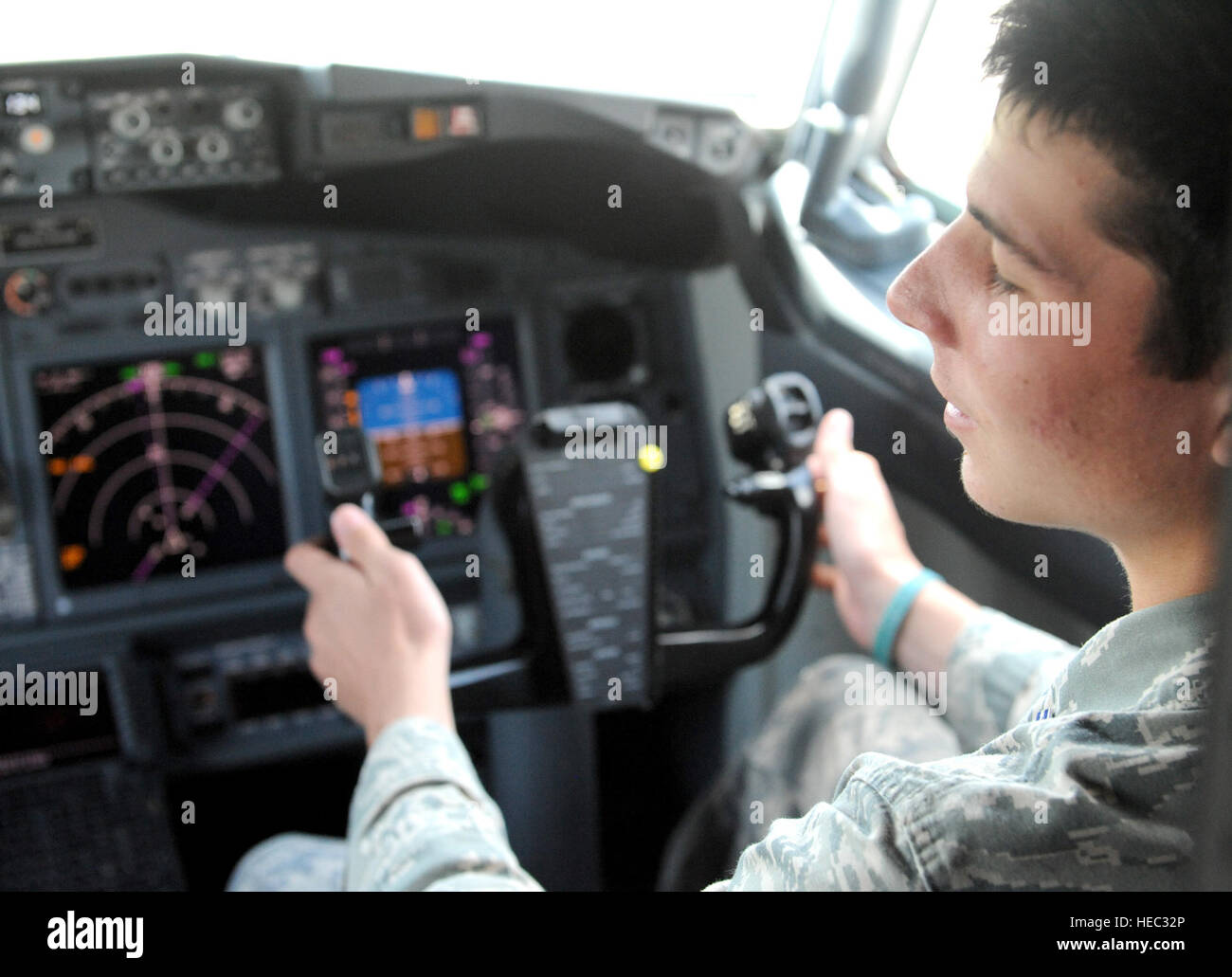U.S. Air Force Academy cadet Andrew Miller sits in the cock pit of USAF ...