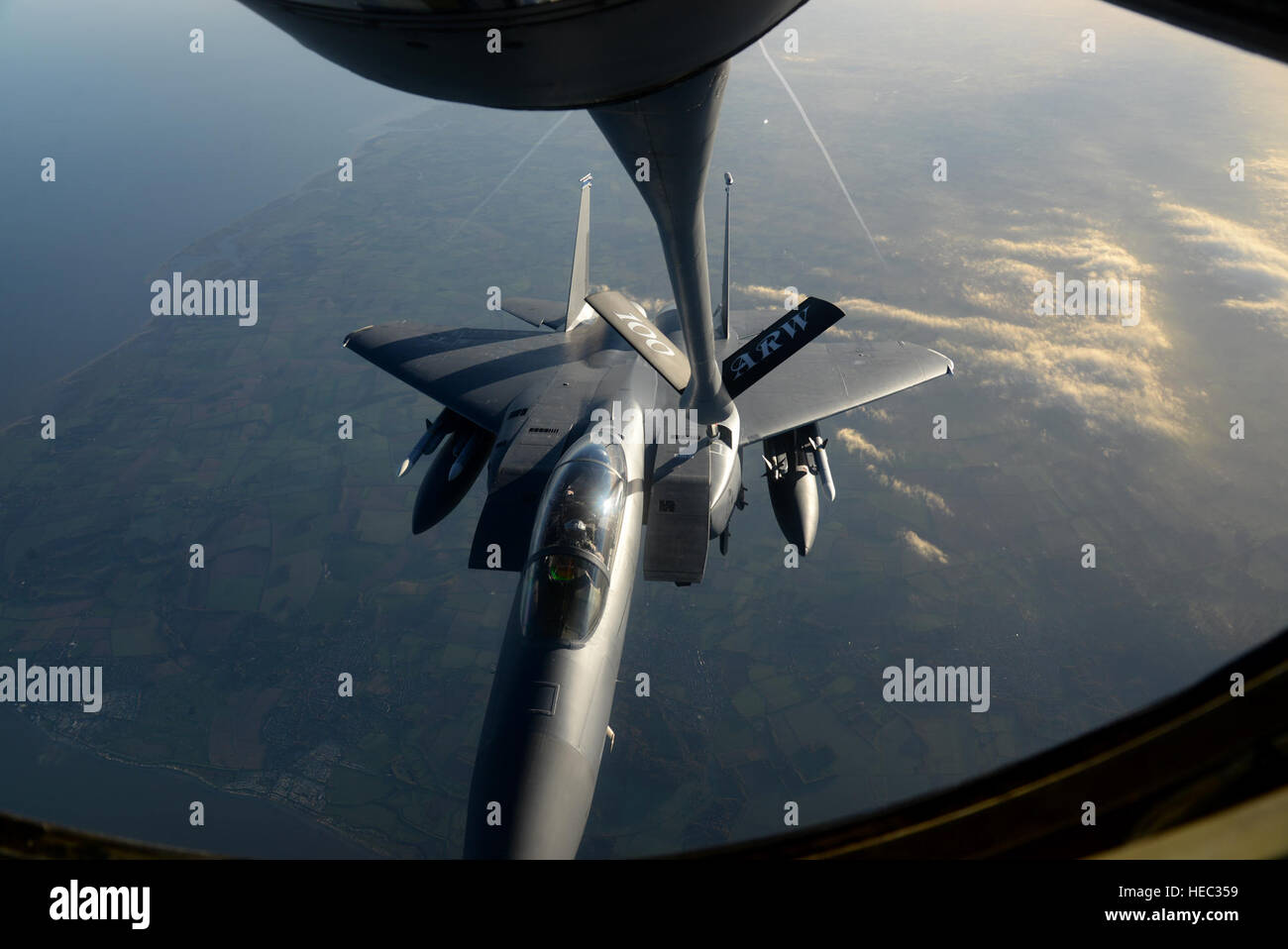 A KC-135 Stratotanker from the 100th Air Refueling Wing refuels an F ...