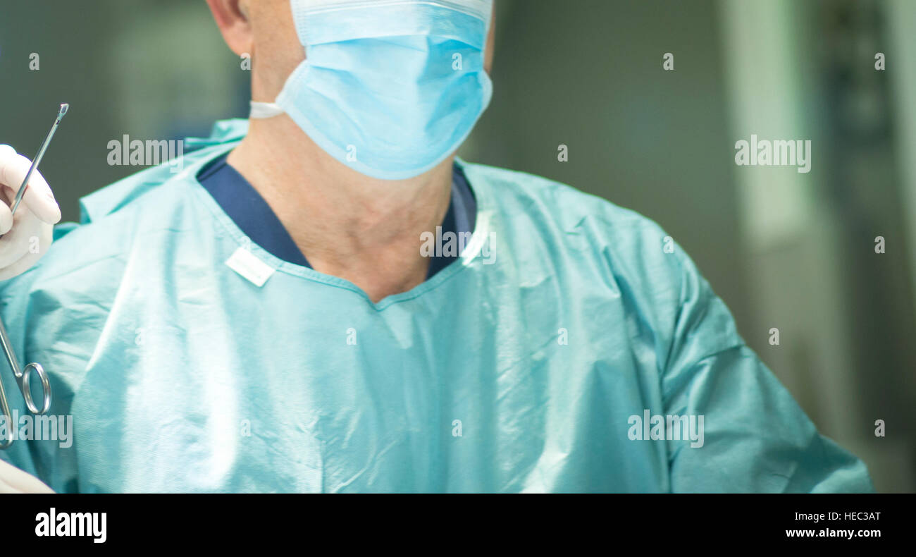 Surgeon in operating theater emergency room surgery in hospital clinic ...