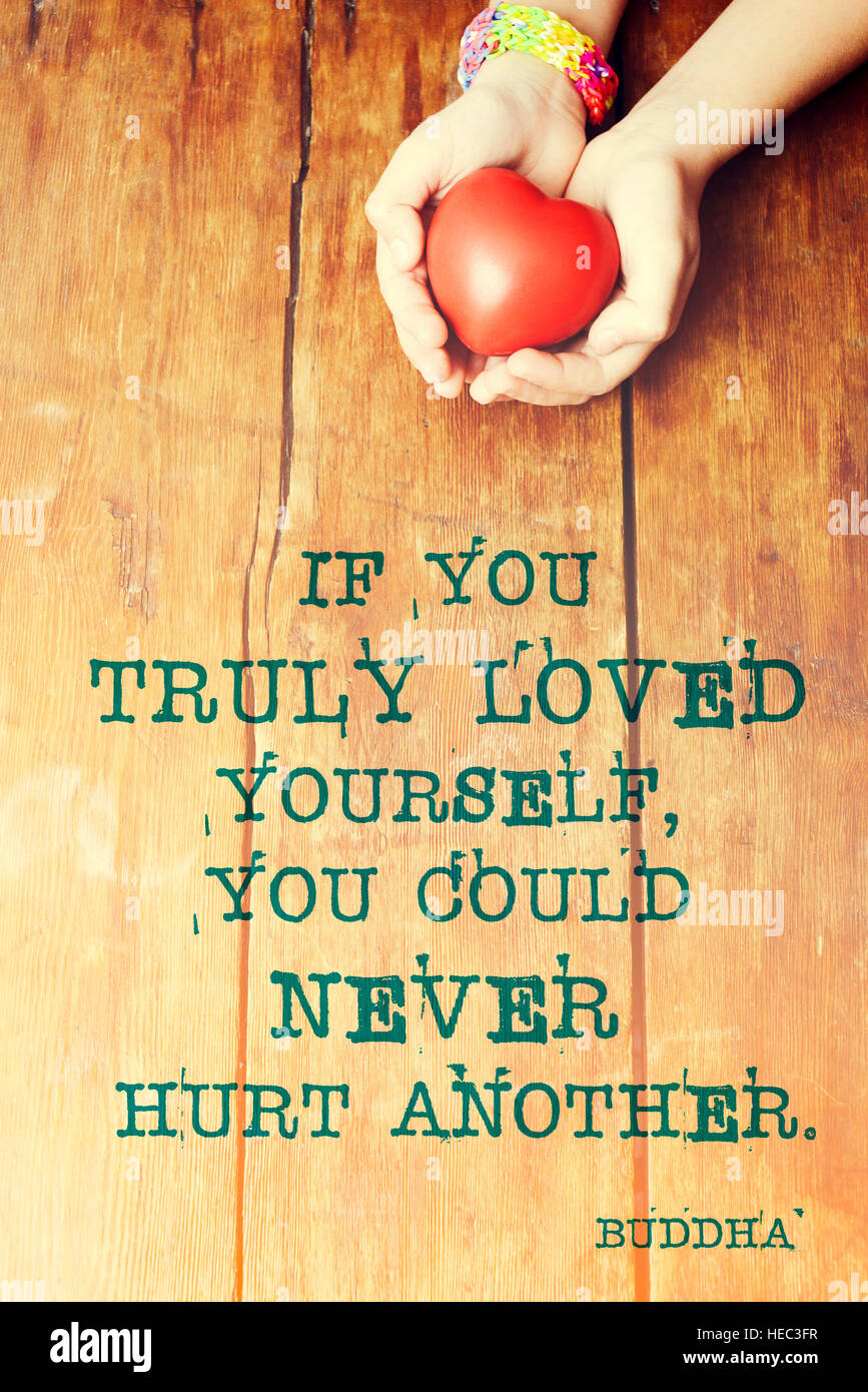 famous Buddha quote about hurt another printed over image with red ...