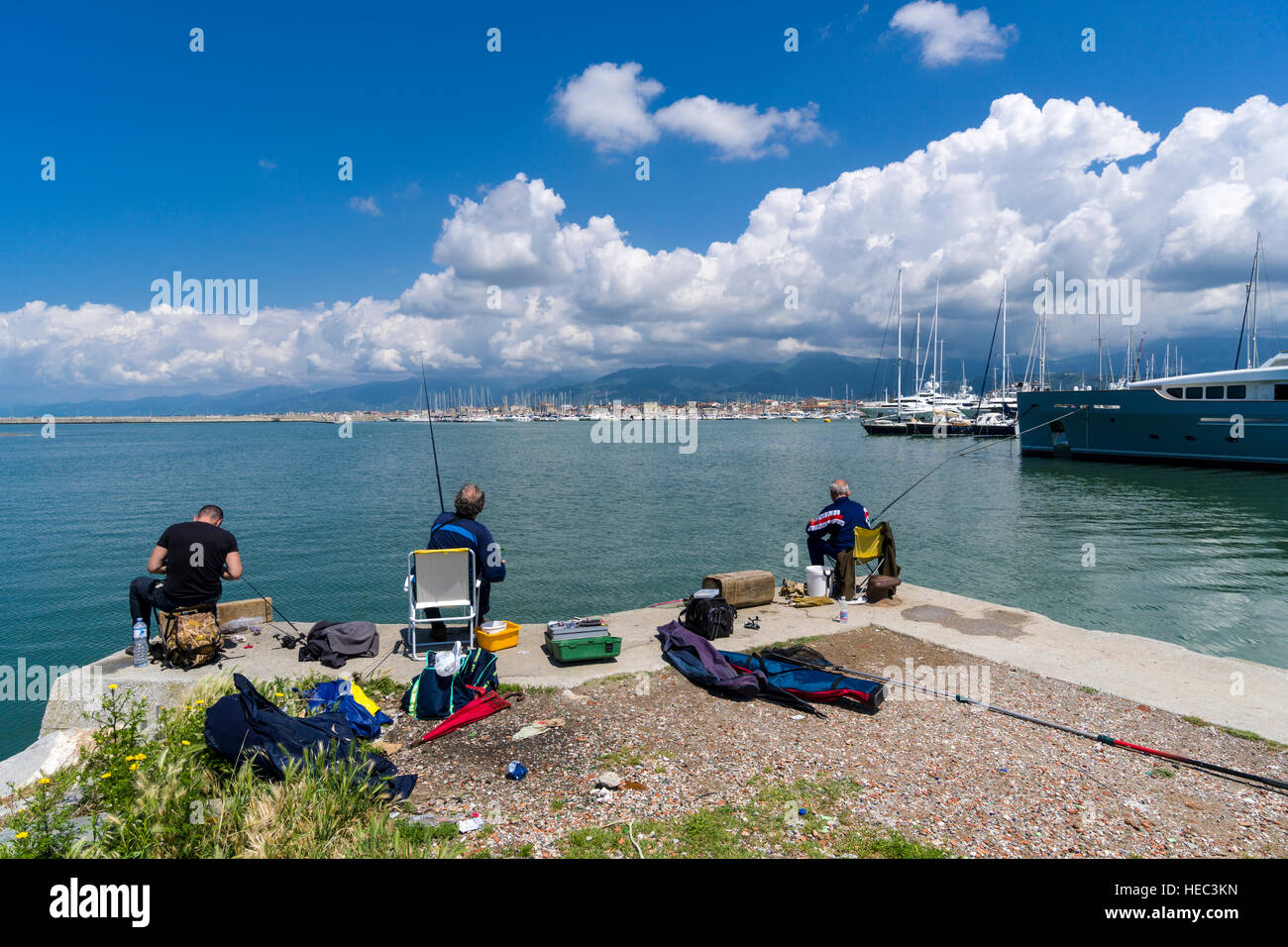Fishermen are catching fish in the harbour Stock Photo - Alamy