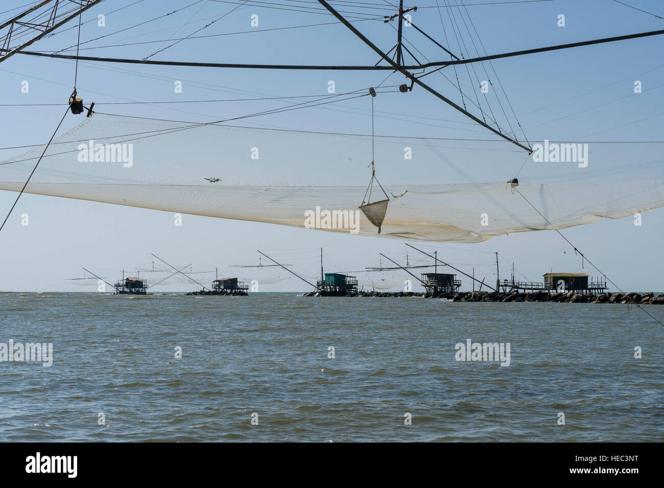 The technic of chinese fishing nets is used outside of the harbour ...