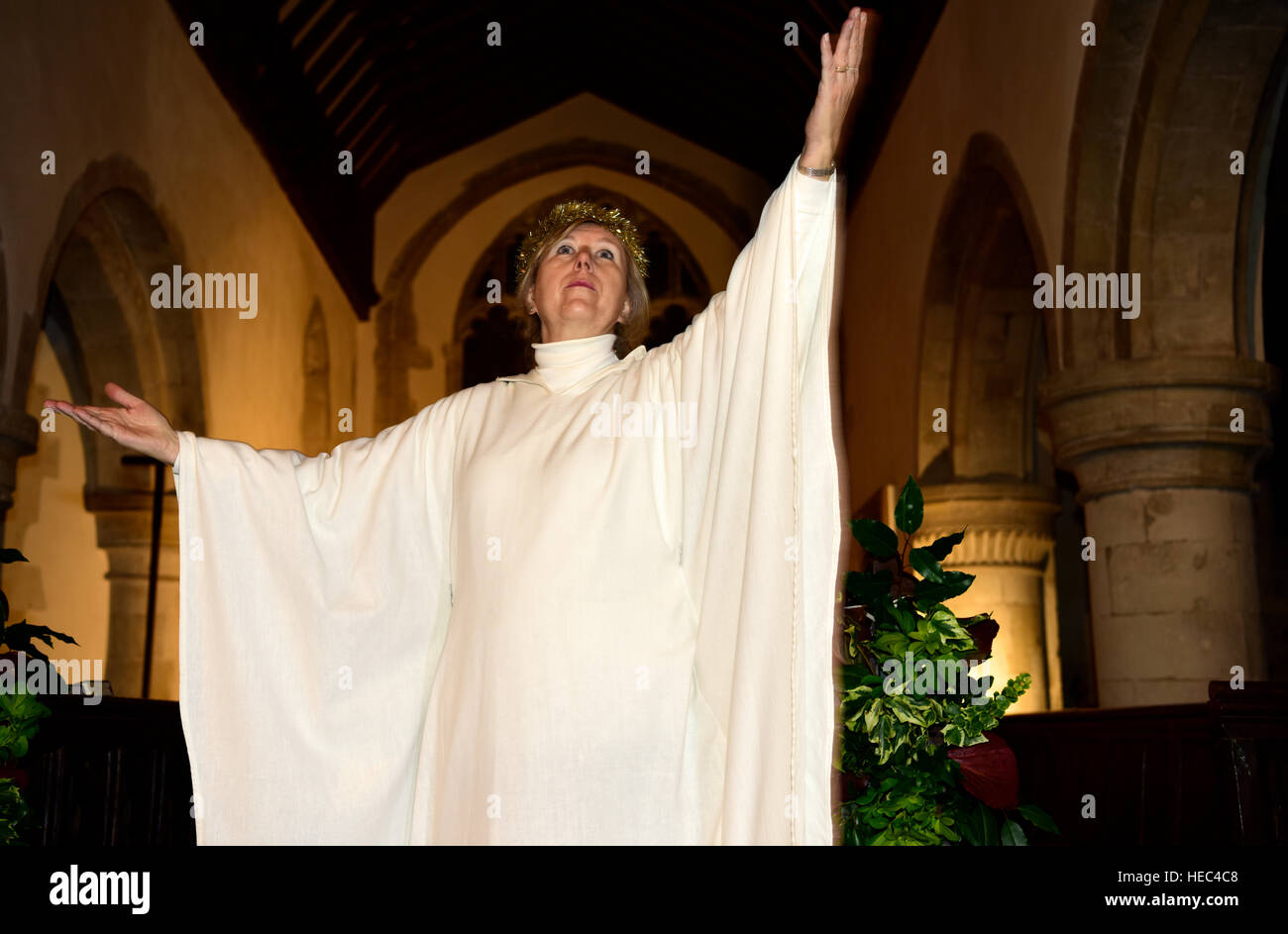 Woman taking the part of the Archangel Gabriel in a village nativity at ...
