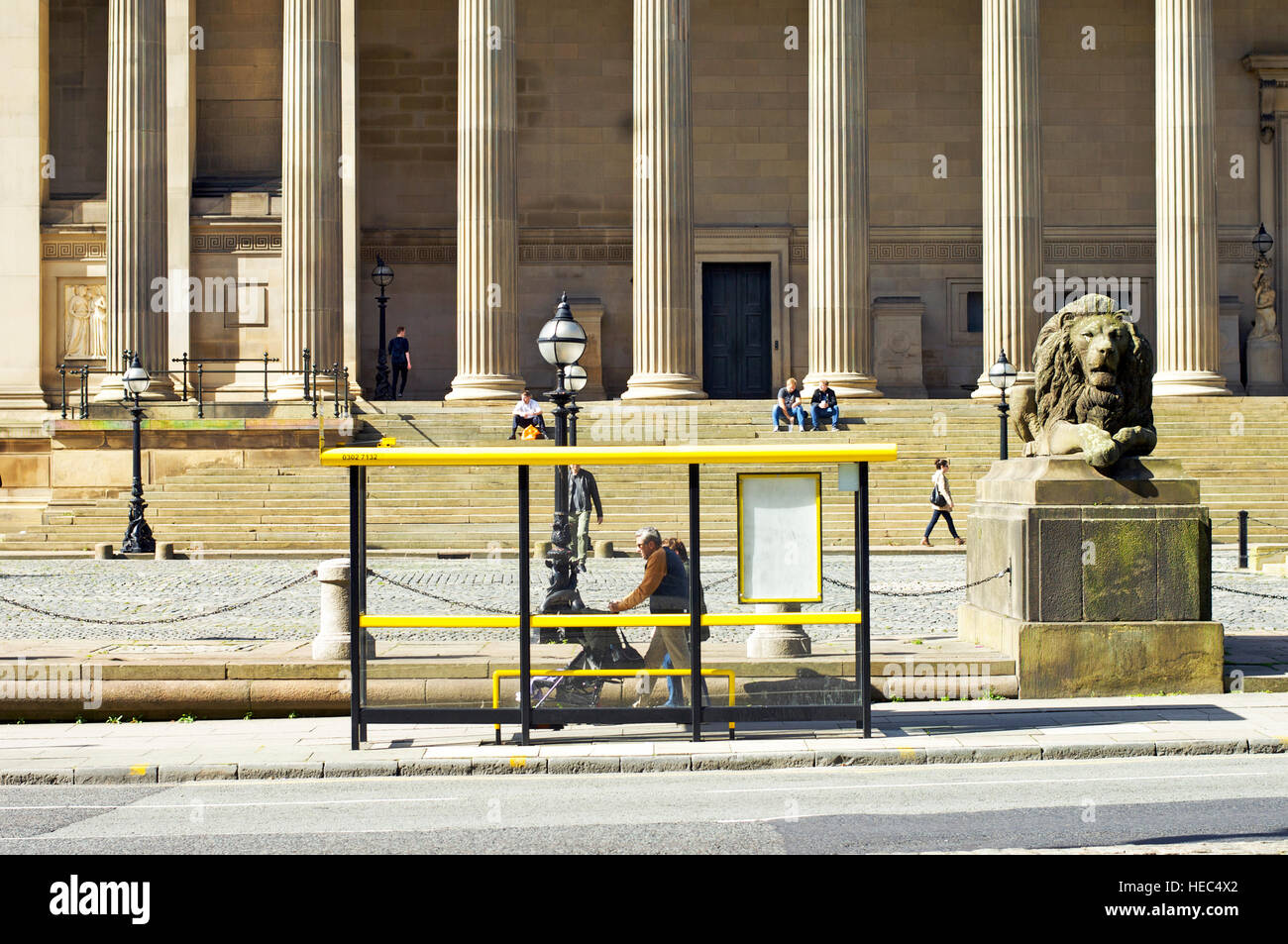 Yellow bus stop in front of King Georges Hall Liverpool Stock Photo - Alamy