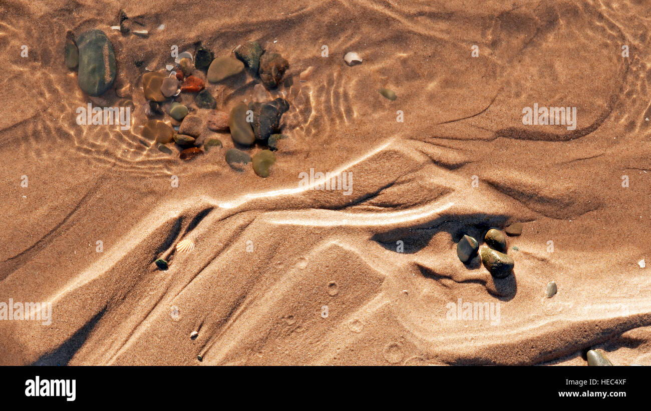 Pebbles in rock pool Stock Photo - Alamy