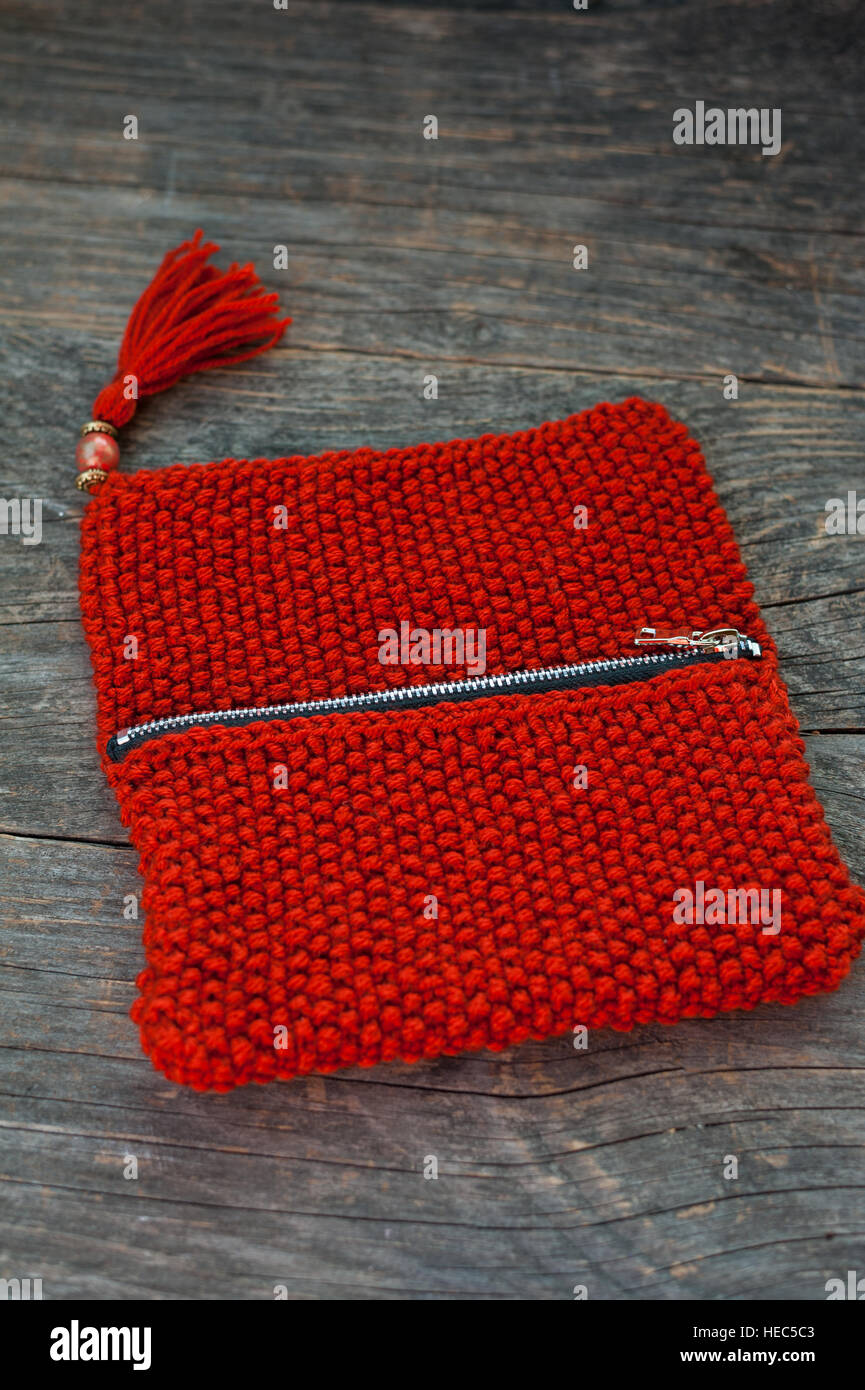 Handmade knitted purse Stock Photo - Alamy
