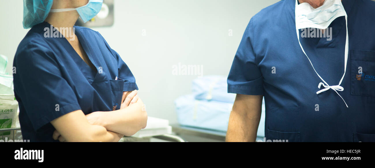 Surgeon in operating theater emergency room surgery in hospital clinic ...