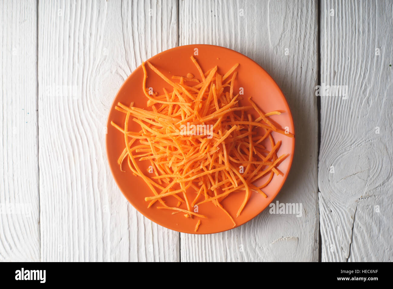 Fresh grated carrot on a plate horizontal Stock Photo - Alamy