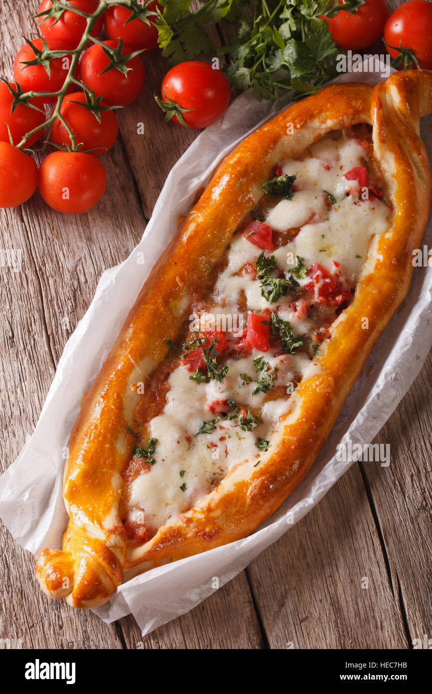 Traditional Turkish pide close up on the table and ingredients ...