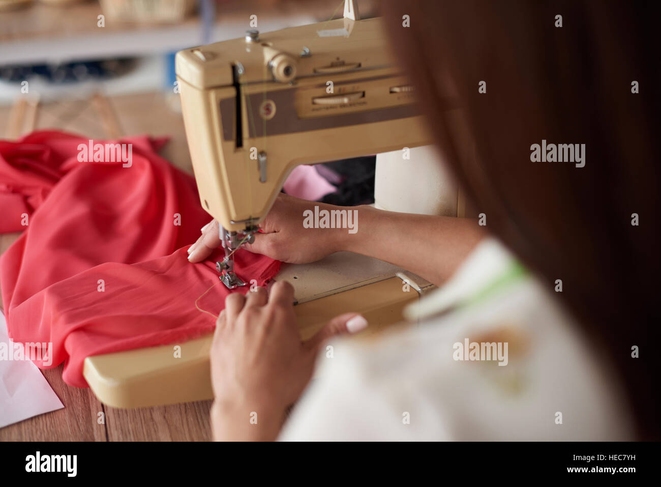 Rear view of busy tailor Stock Photo - Alamy