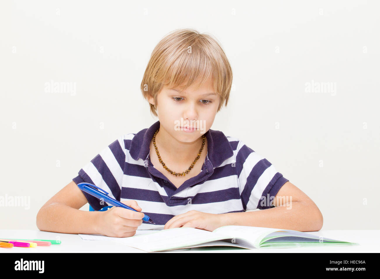 Little kid at home doing homework Stock Photo - Alamy