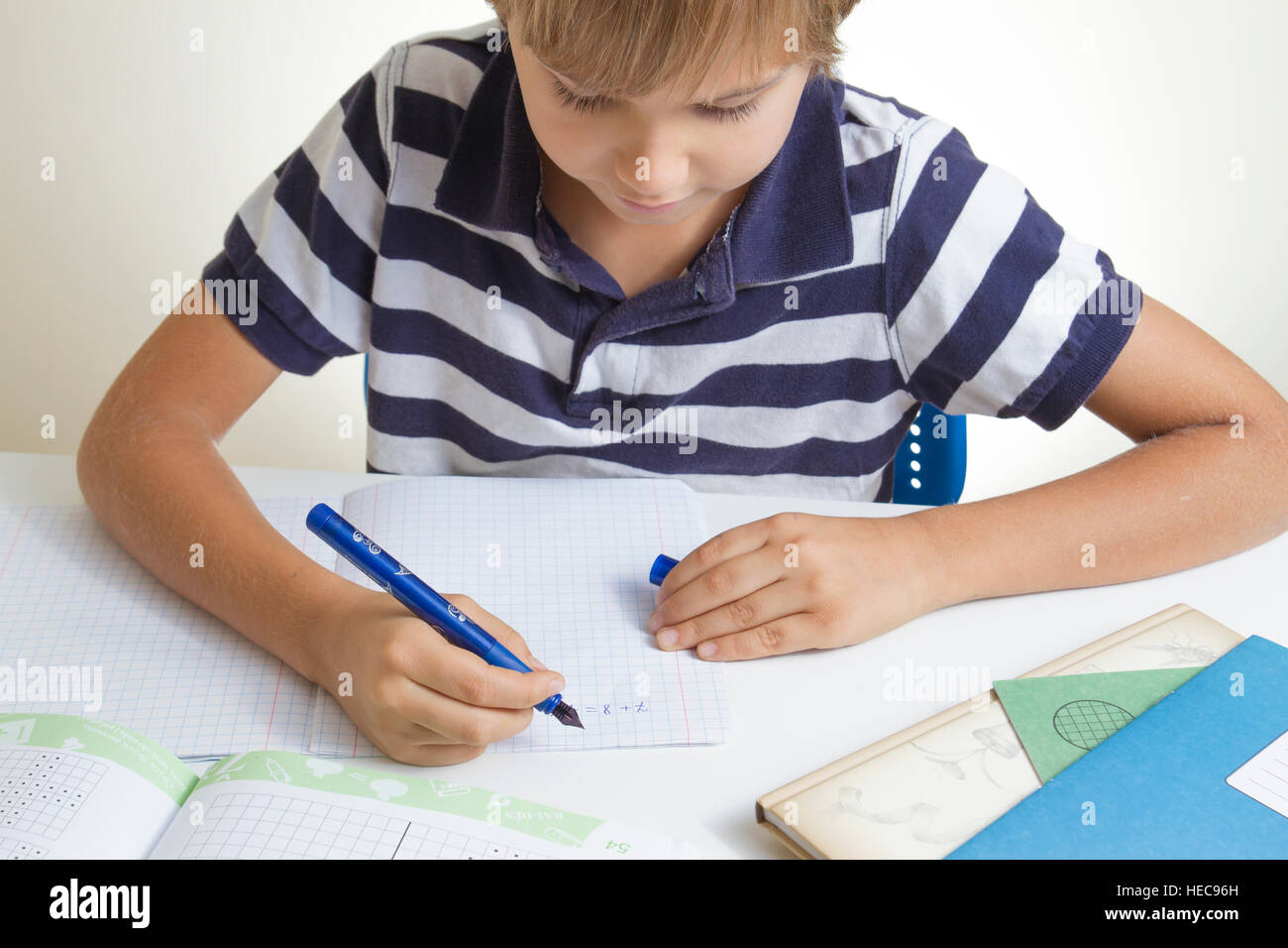 Little kid at home doing homework Stock Photo - Alamy