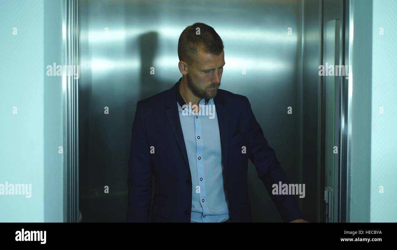 young and successful businessman gets in an Elevator Stock Photo - Alamy
