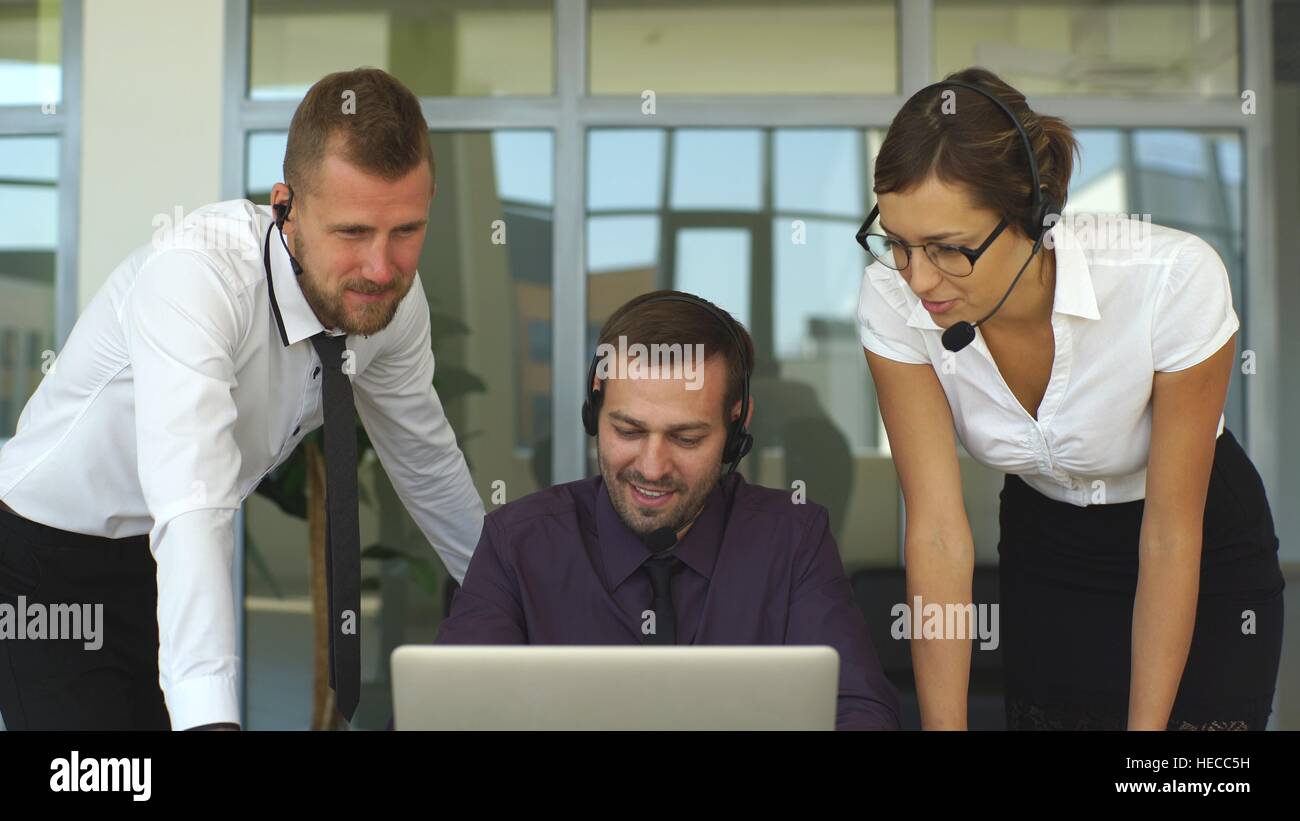 smiling young call center agents at work Stock Photo - Alamy
