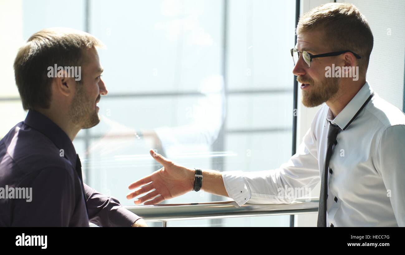 the two men met on the stairs of the office and actively communicate ...