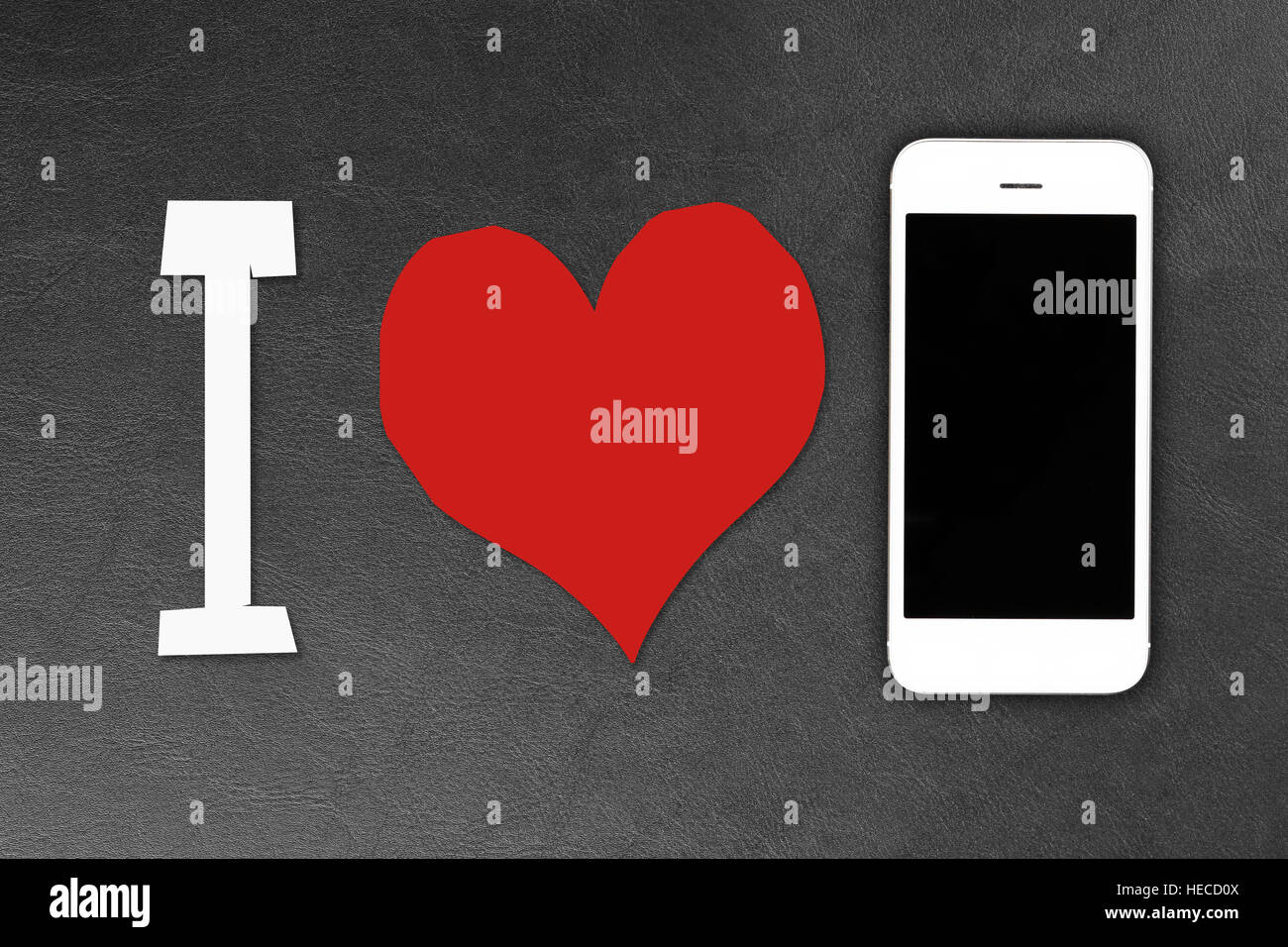 White smartphones lying on dark surface Stock Photo - Alamy