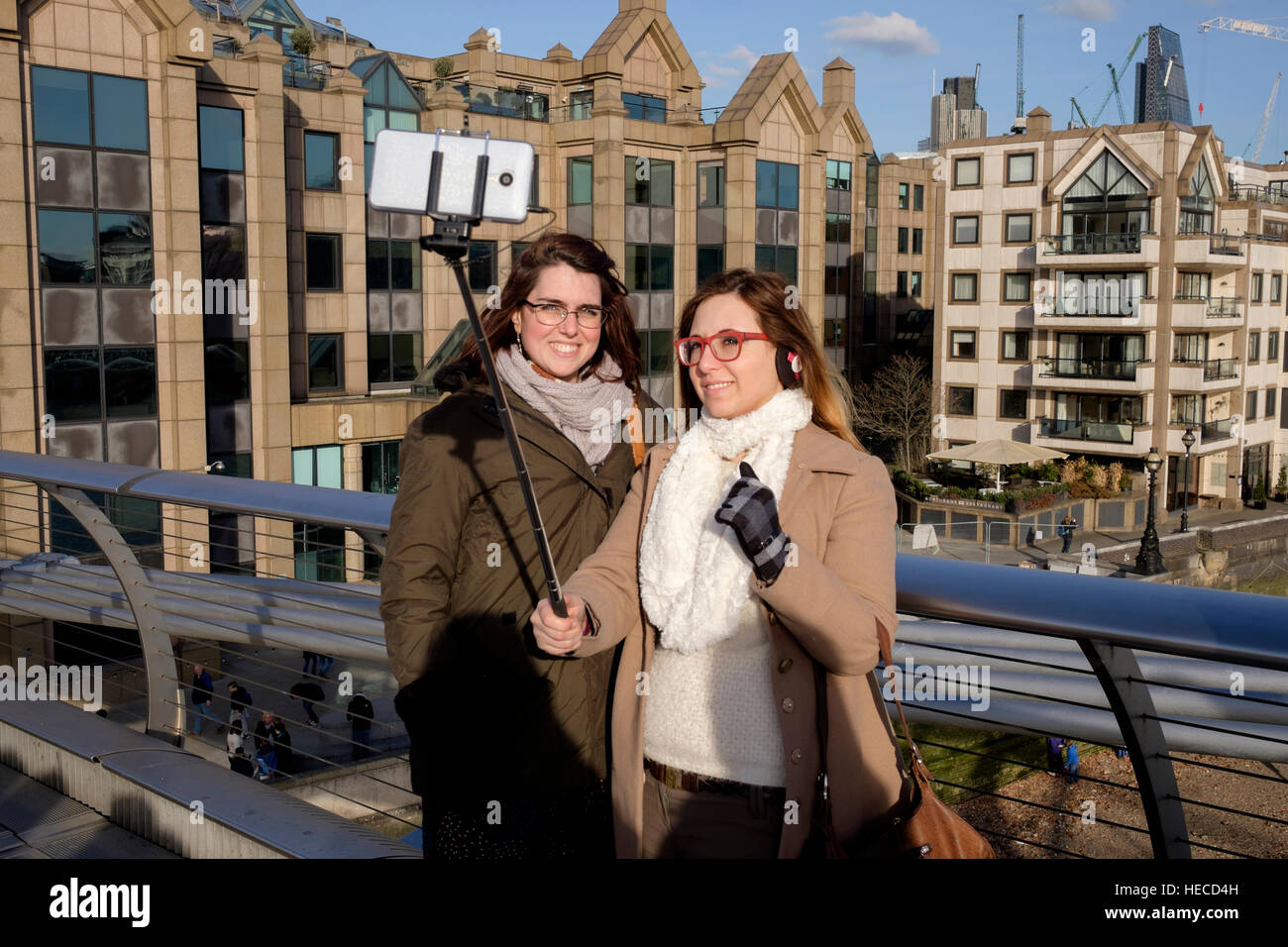 Selfie stick time on London's Millennium Bridge, London, UK Stock Photo ...