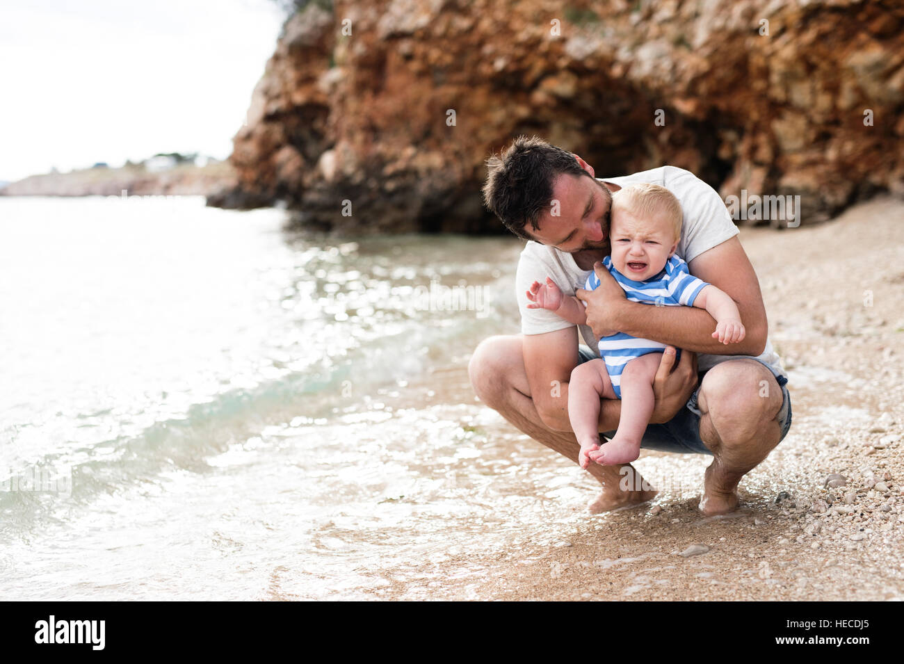 Baby crying beach hi-res stock photography and images - Alamy