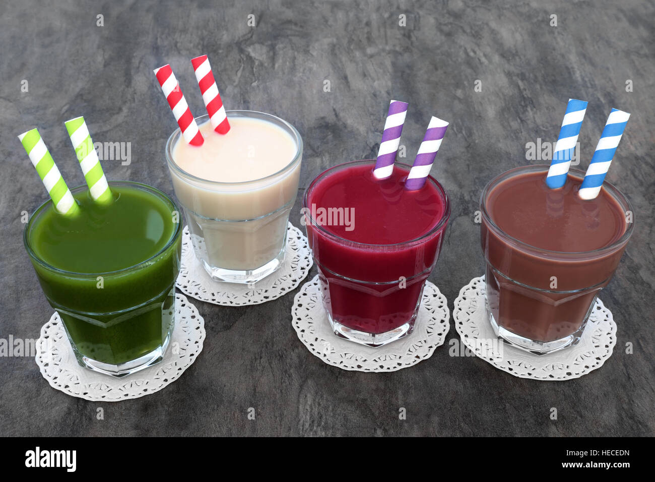 Health food drinks of wheat grass, maca root, acai berry and chocolate ...