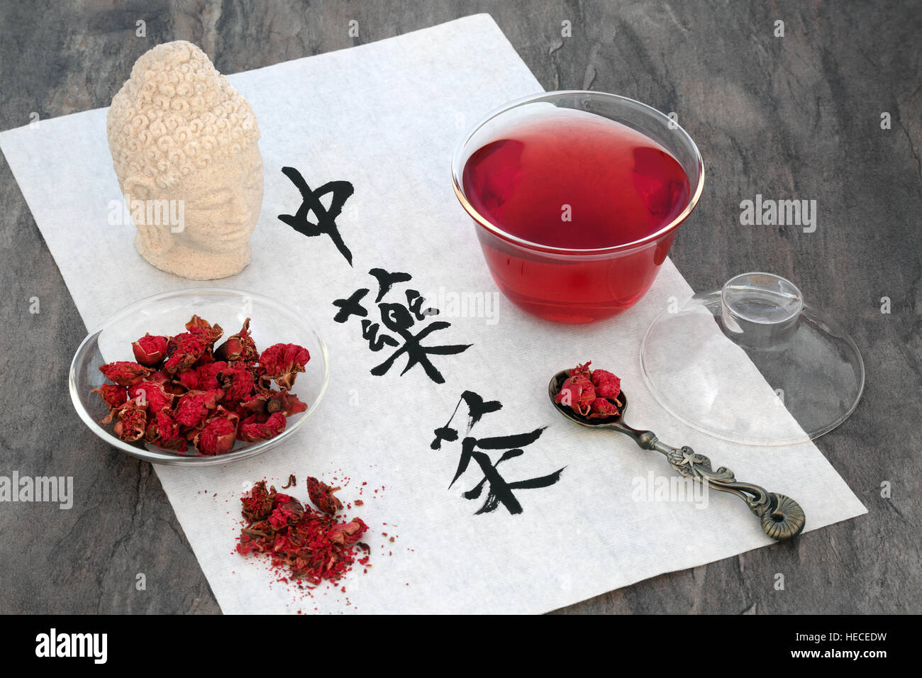 Chinese pomegranate herb flower tea with calligraphy on rice paper ...